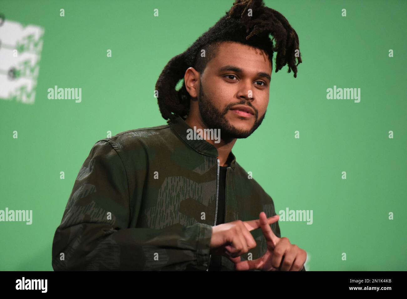 The Weeknd poses in the press room at the MTV Video Music Awards at the ...
