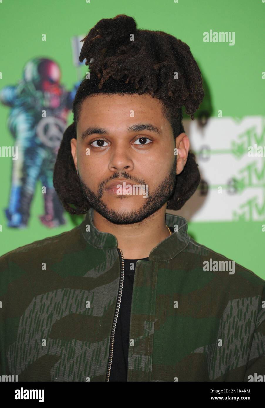 The Weeknd poses in the press room at the MTV Video Music Awards at the ...