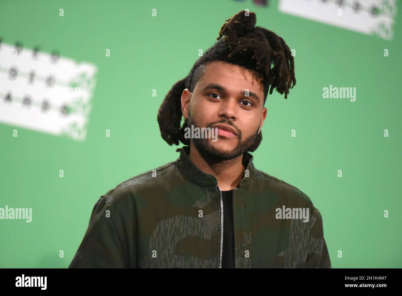 The Weeknd poses in the press room at the MTV Video Music Awards at the ...