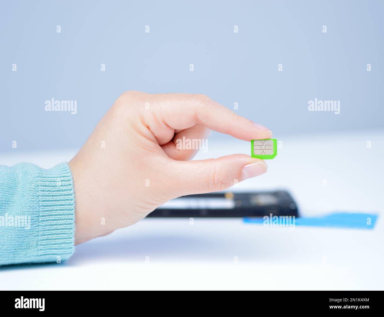 Sim card hand hi-res stock photography and images - Alamy