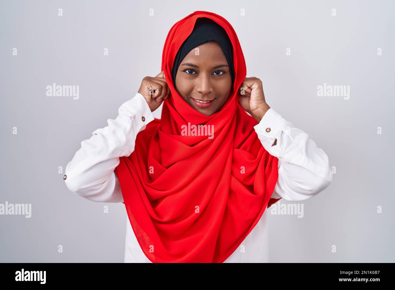 Young arab woman wearing traditional islamic hijab scarf smiling ...