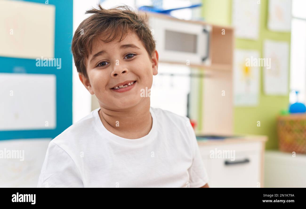 Adorable hispanic boy smiling confident standing at kindergarten Stock ...