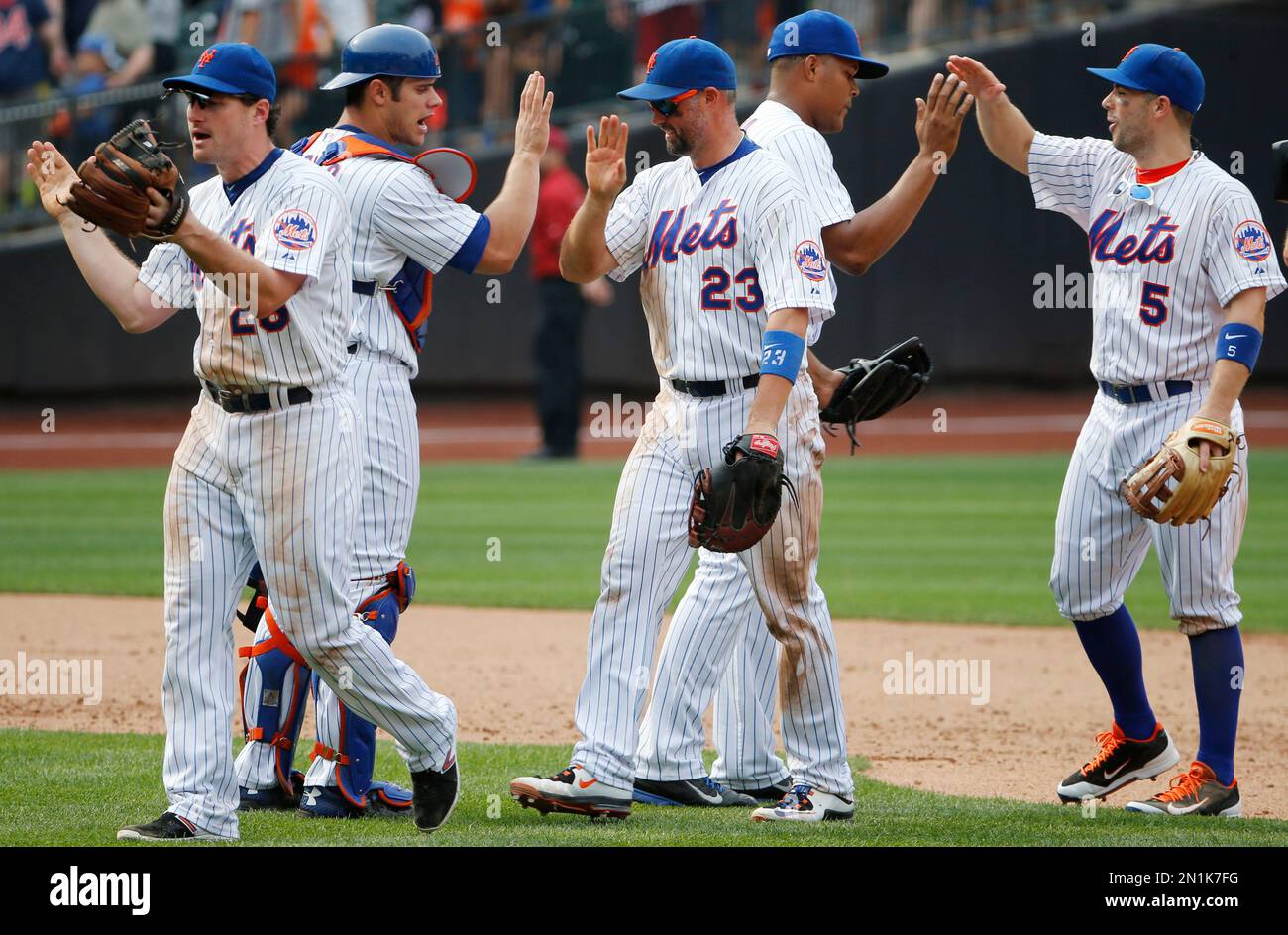 From left to right, New York Mets second baseman Daniel Murphy, catcher ...