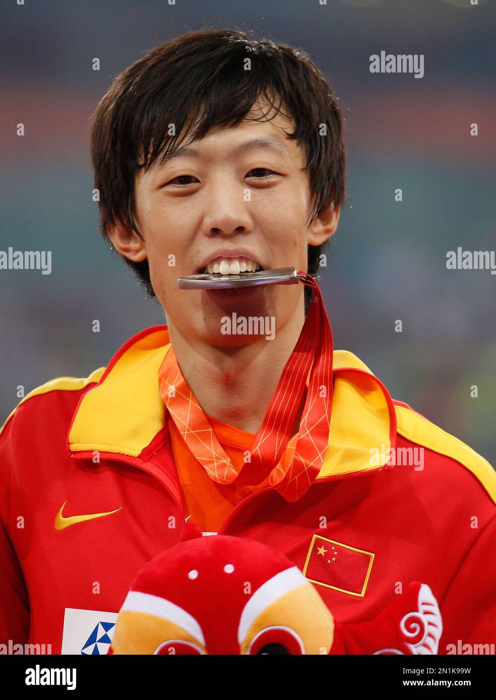China's Zhang Guowei poses with his silver medal during the ceremony for the men’s high jump at ...