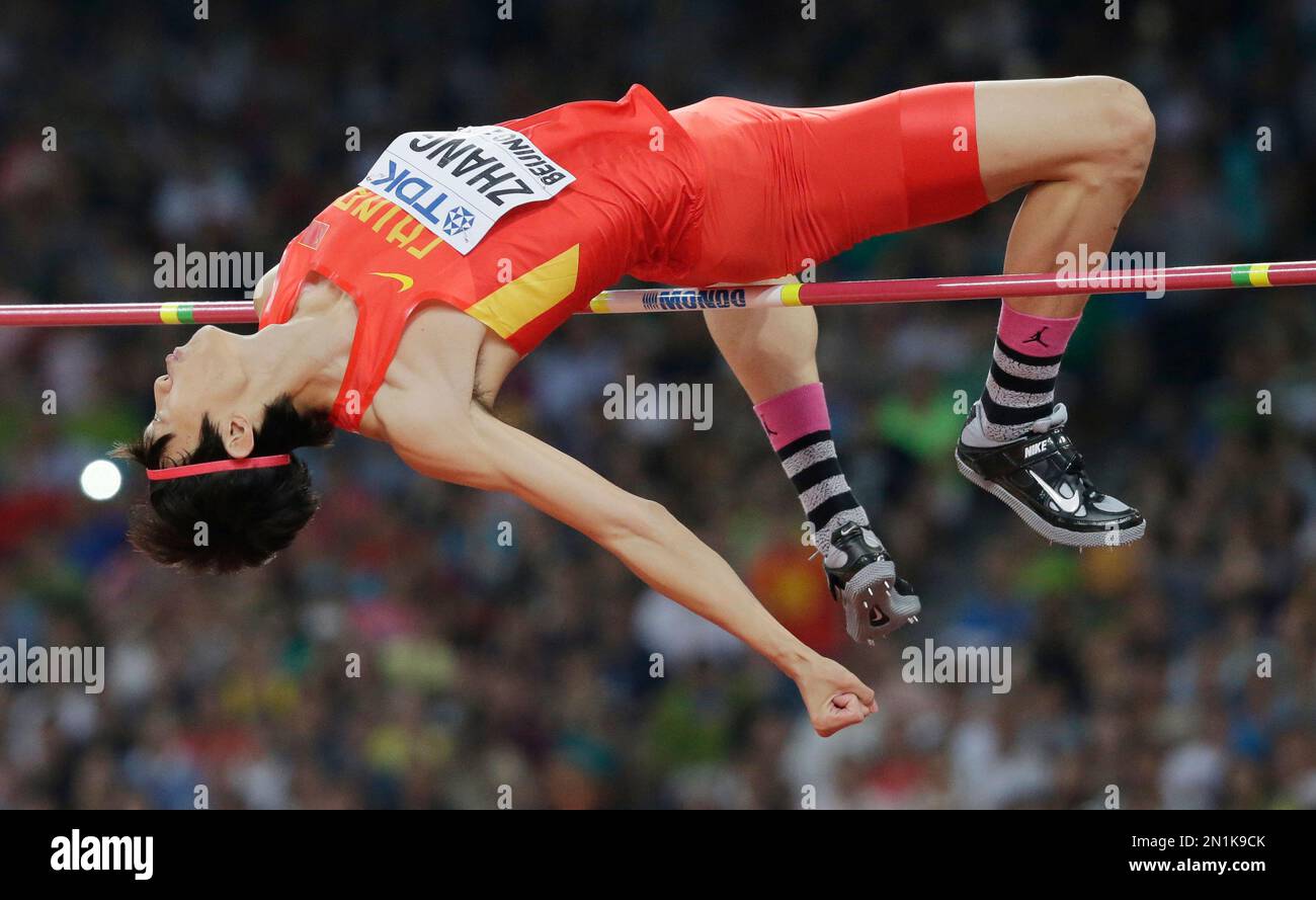 China's Zhang Guowei clears the bar in the men’s high jump final at the ...