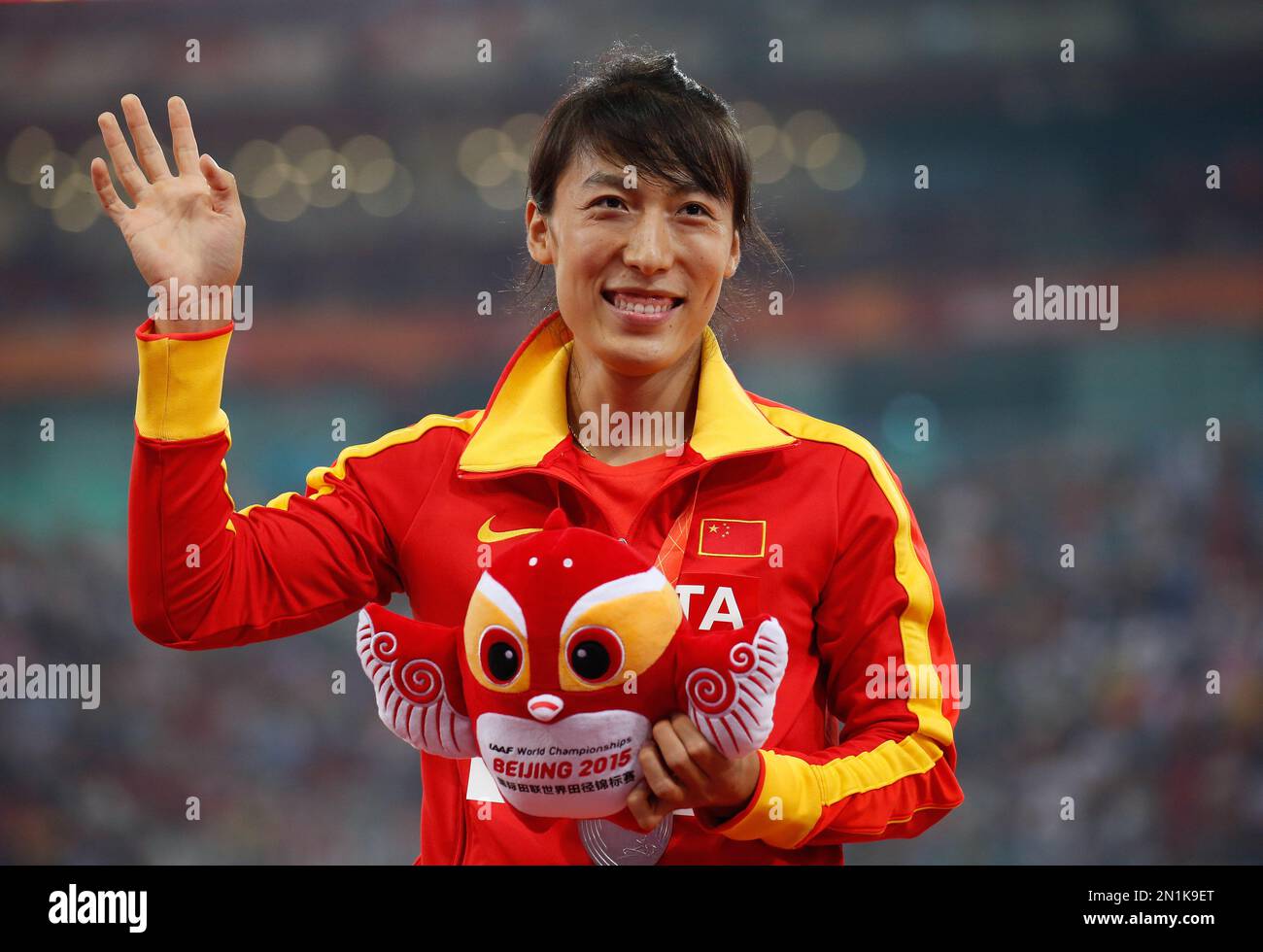 China's Lyu Huihui smiles on the podium after winning a solver medal in ...