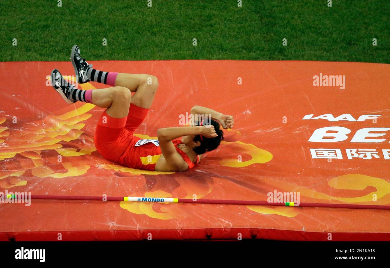 China's Zhang Guowei reacts on his way to winning the silver medal in ...
