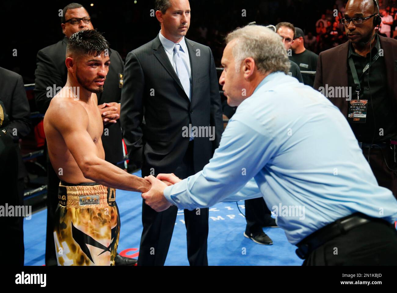 Referee Jack Reiss, right, shakes hands with Abner Mares, left, after ...