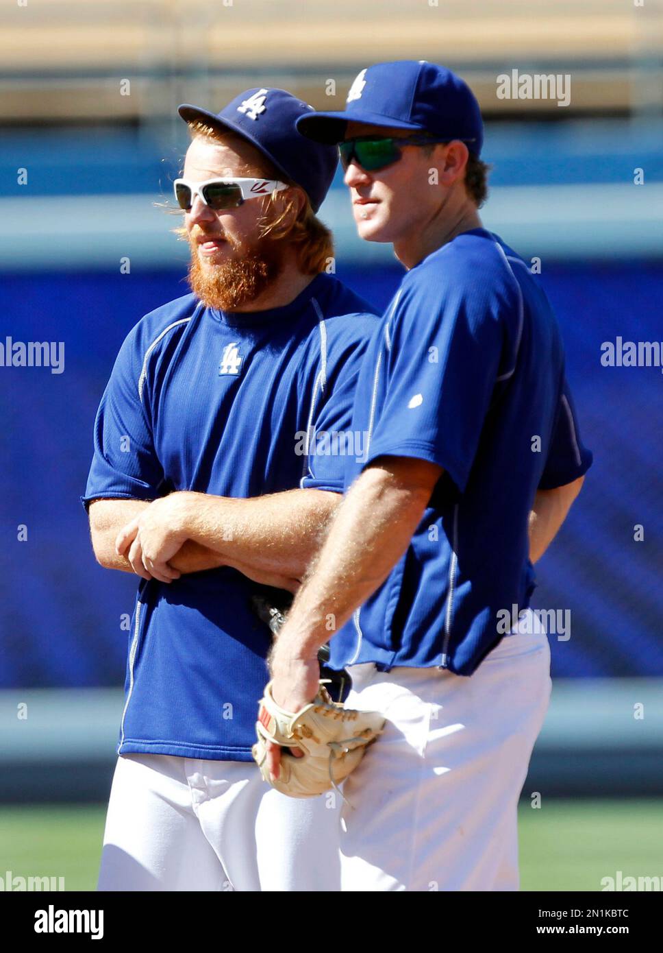 Los Angeles Dodgers' Justin Turner, left, and Chase Utley, right, talk ...