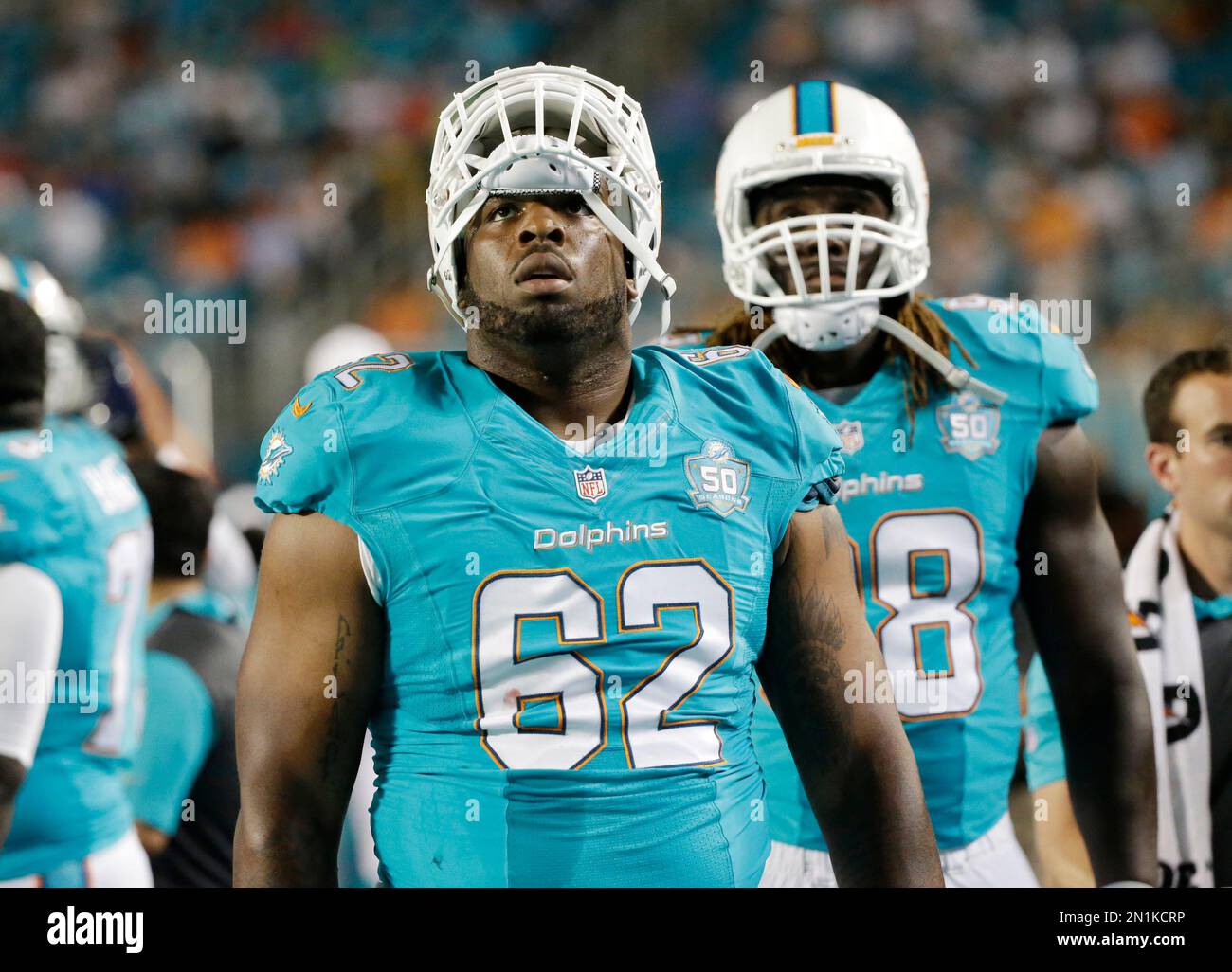 Miami Dolphins defensive tackle Deandre Coleman (62) and defensive end ...