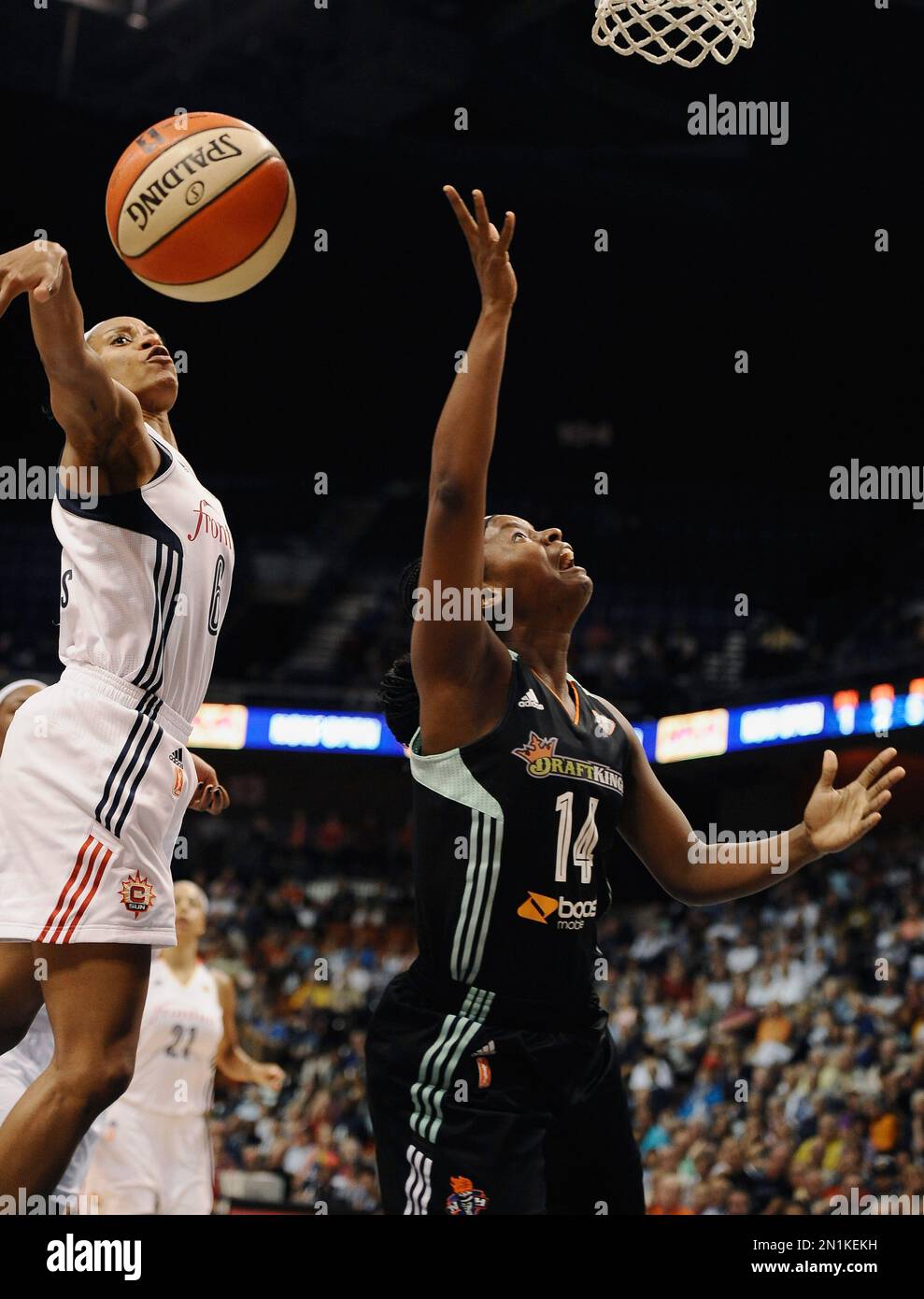 Connecticut Sun’s Jasmine Thomas, left, blocks a shot attempt by New ...