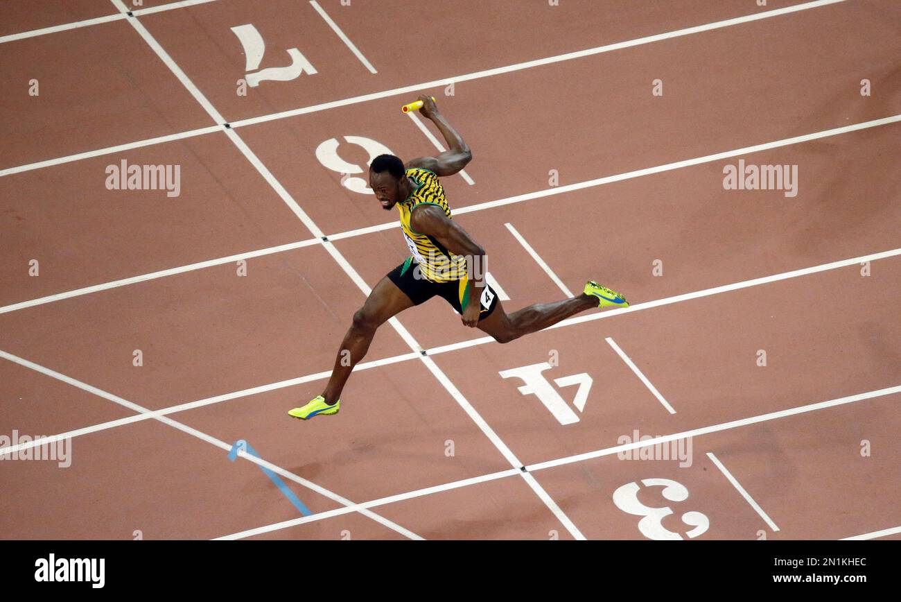 Jamaica's Usain Bolt crosses the finish line as Jamaica wins the men's ...