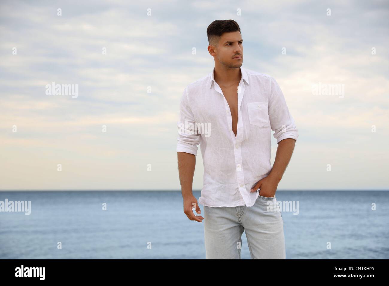 Handsome man on beach hi-res stock photography and images - Alamy