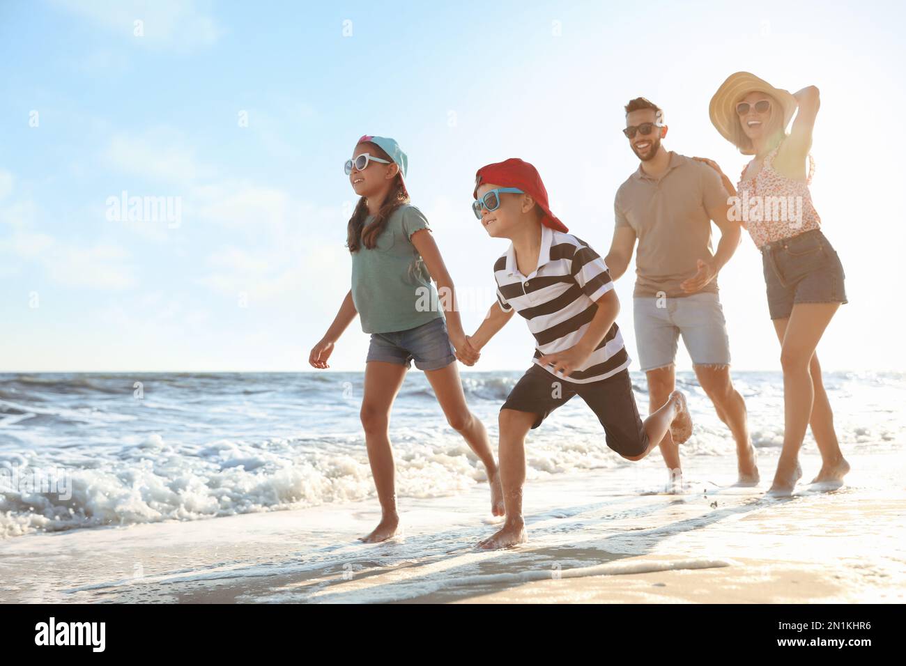 Happy family running hi-res stock photography and images - Alamy