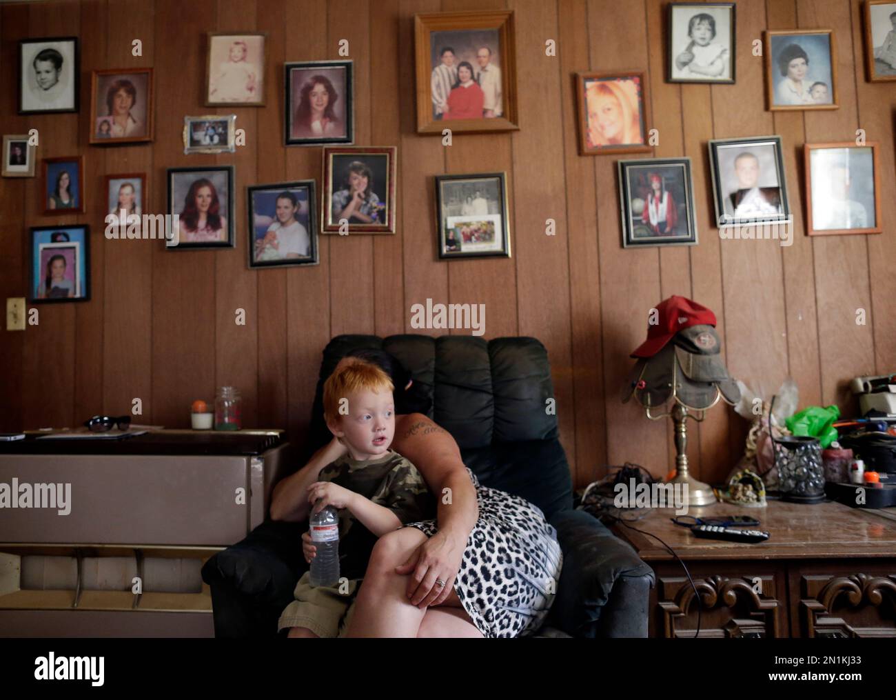In this July 2, 2015 photo, Brandon Dunlap, 3, sits on the lap of his ...