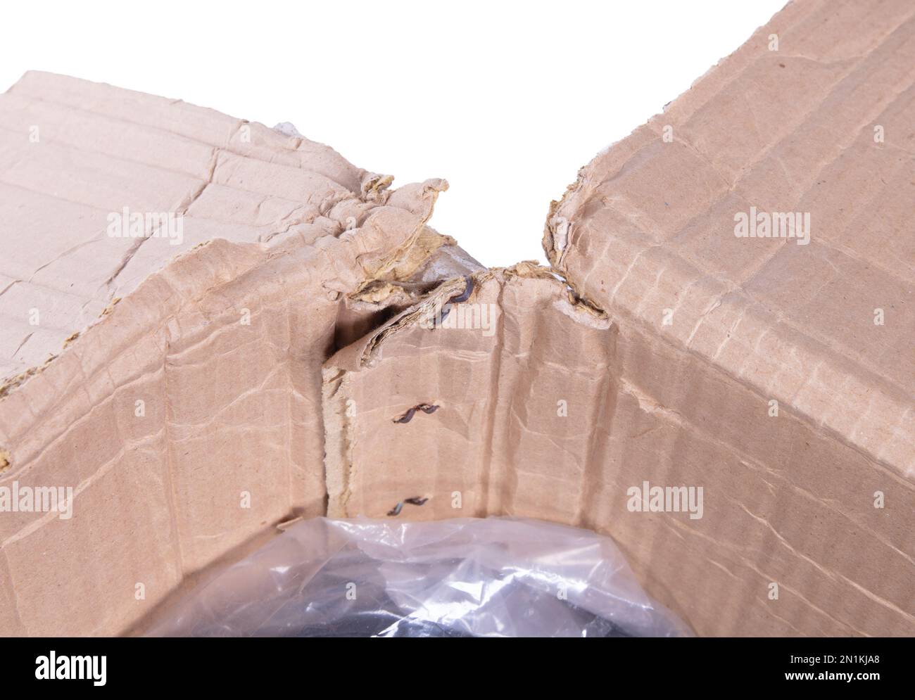 Battered cartboard box isolated on a white background Stock Photo - Alamy