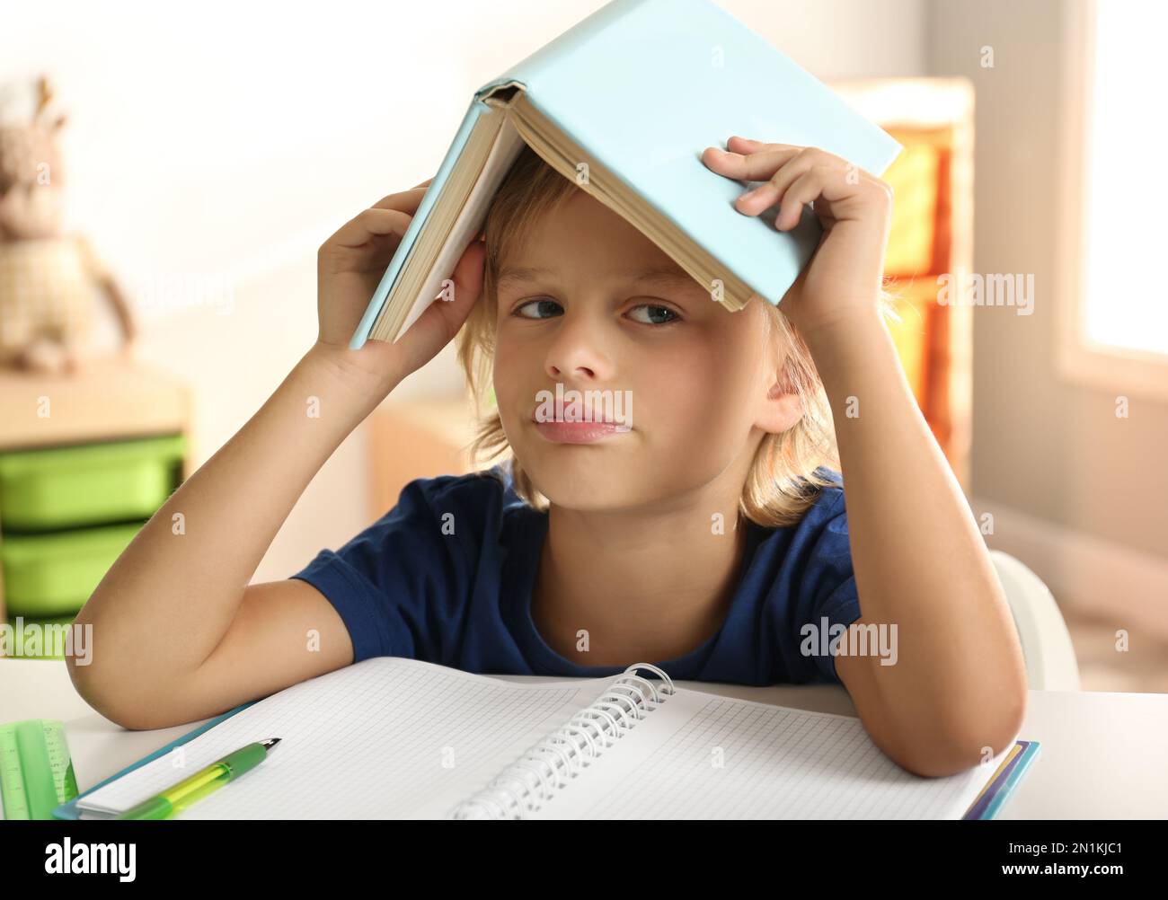 Confused kid on study table hi-res stock photography and images - Alamy