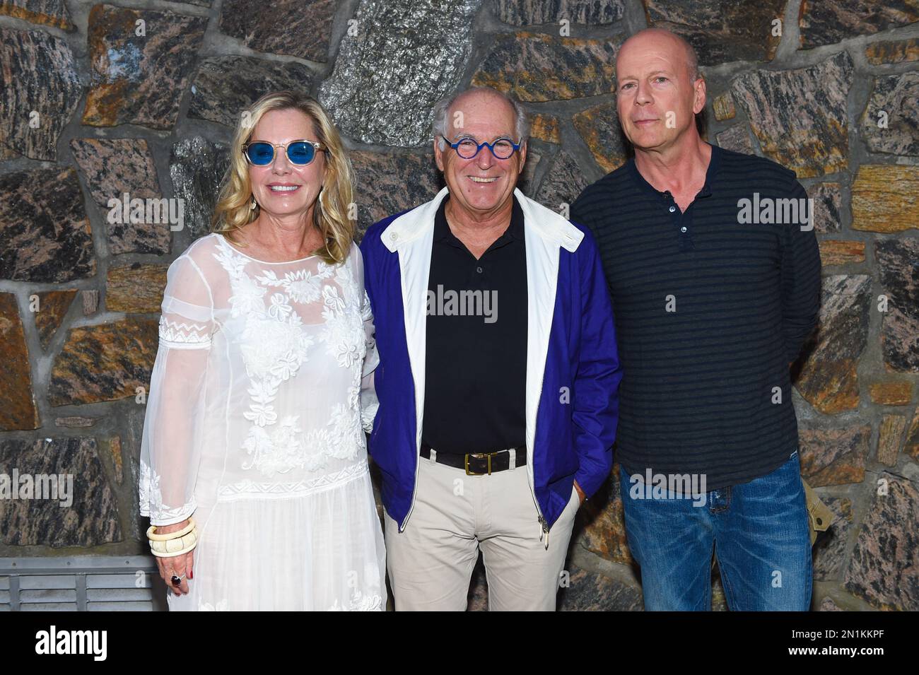 Actor Bruce Willis, right, recording artist Jimmy Buffett, center, and ...