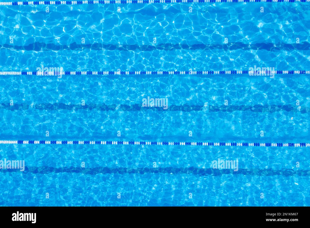 Swimming pool with racing lane dividers, top view Stock Photo - Alamy