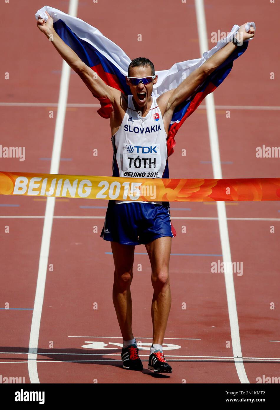 Slovakia's Matej Toth celebrates as he crosses the finish line to win ...