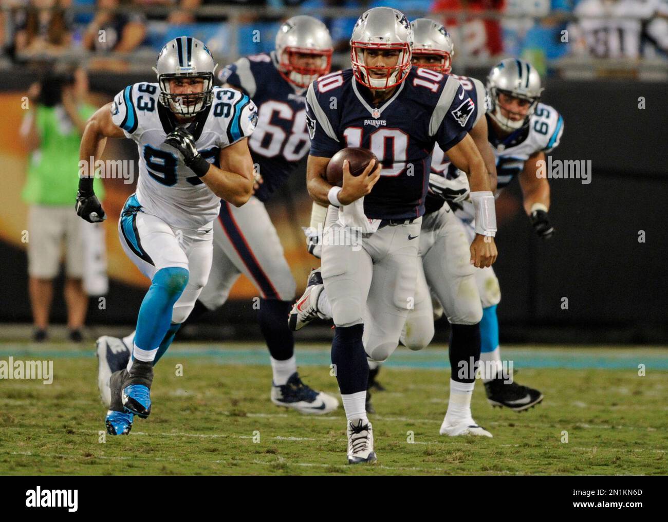 New England Patriots' Jimmy Garoppolo (10) scrambles past Carolina ...