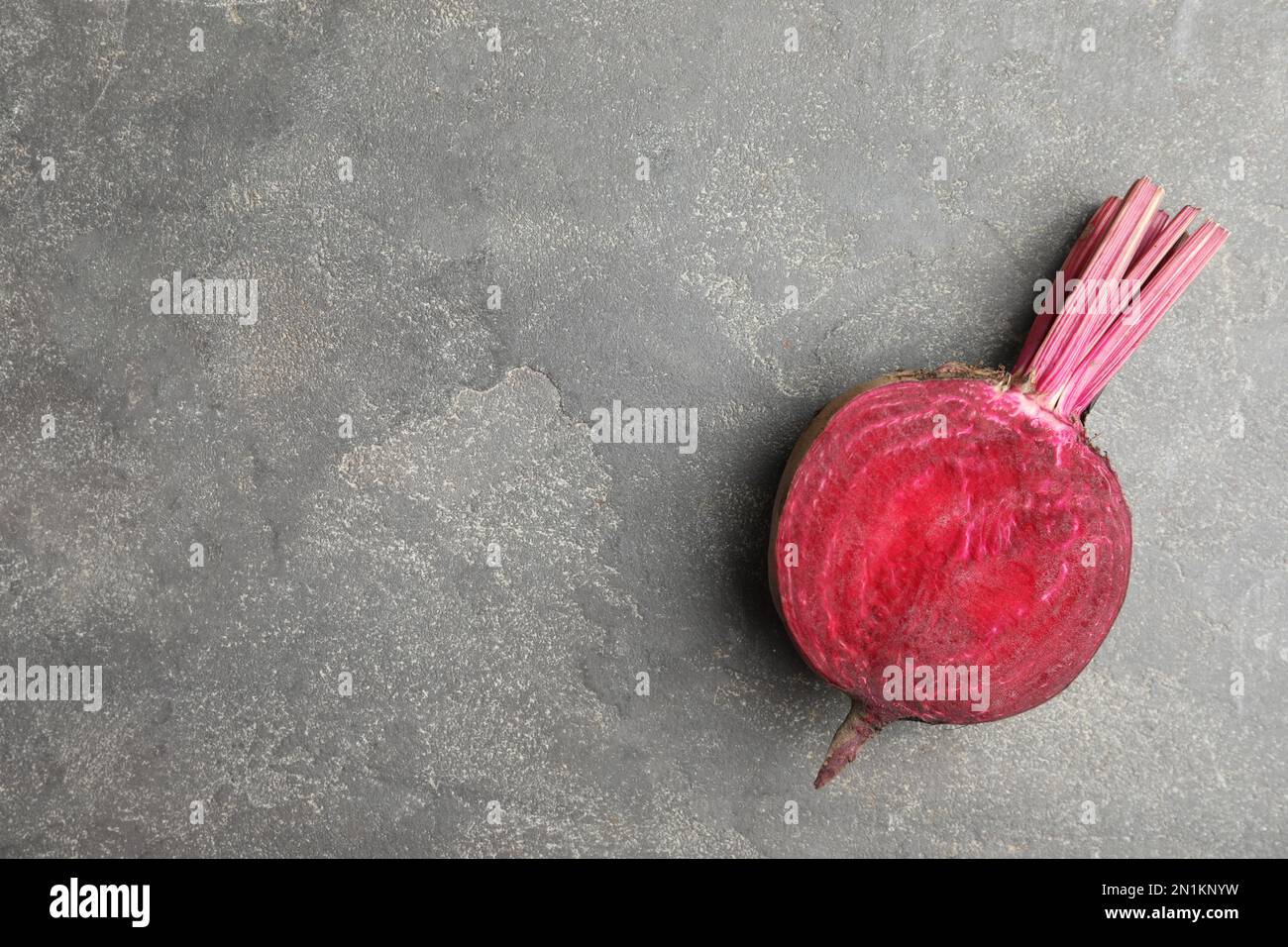 Half of raw beet on grey table, top view. Space for text Stock Photo ...