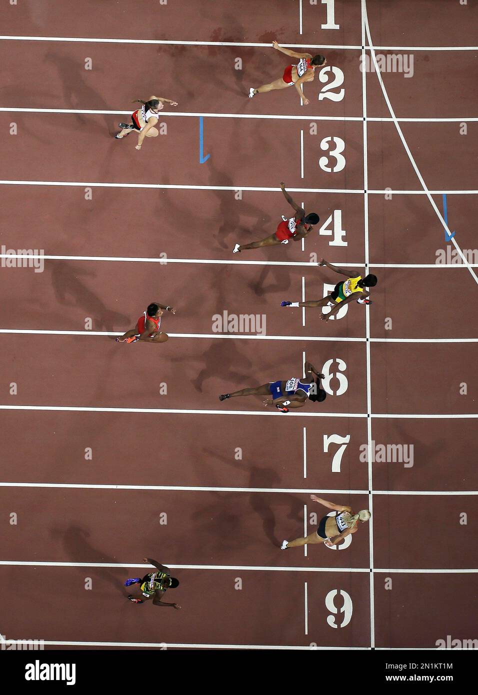 Jamaica's Danielle Williams, lane 5, crosses the finish line to win the ...