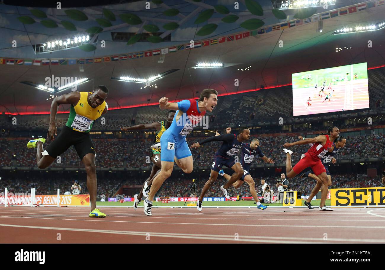 Russia's Sergey Shubenkov, second left, crosses the finish line to win ...