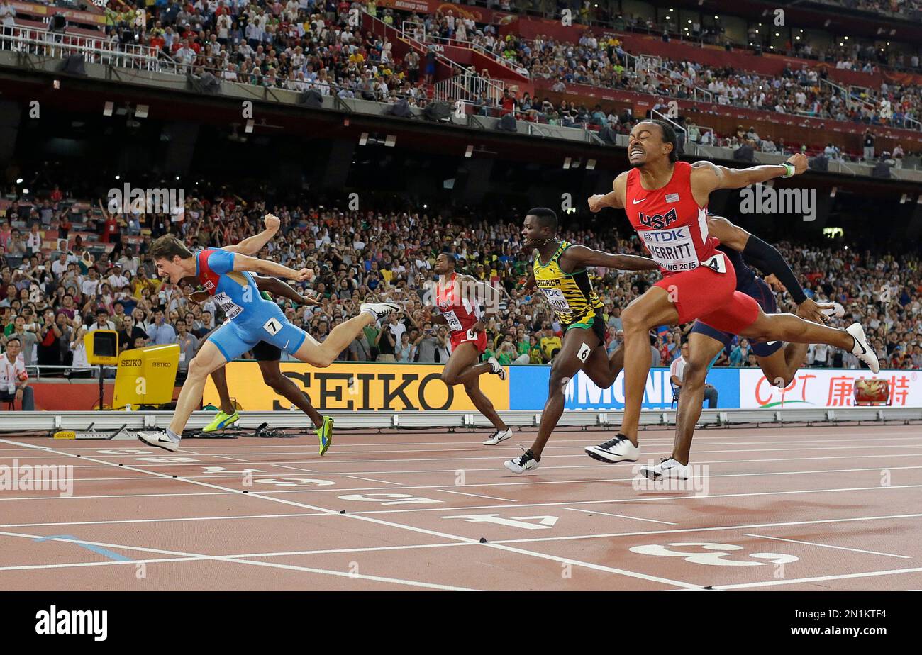 Russia's Sergey Shubenkov, left, crosses the finish line to win the men ...