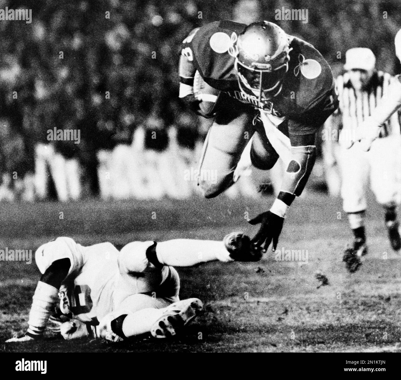 Sam Platt of Florida State gets airborne as he avoids an University of ...