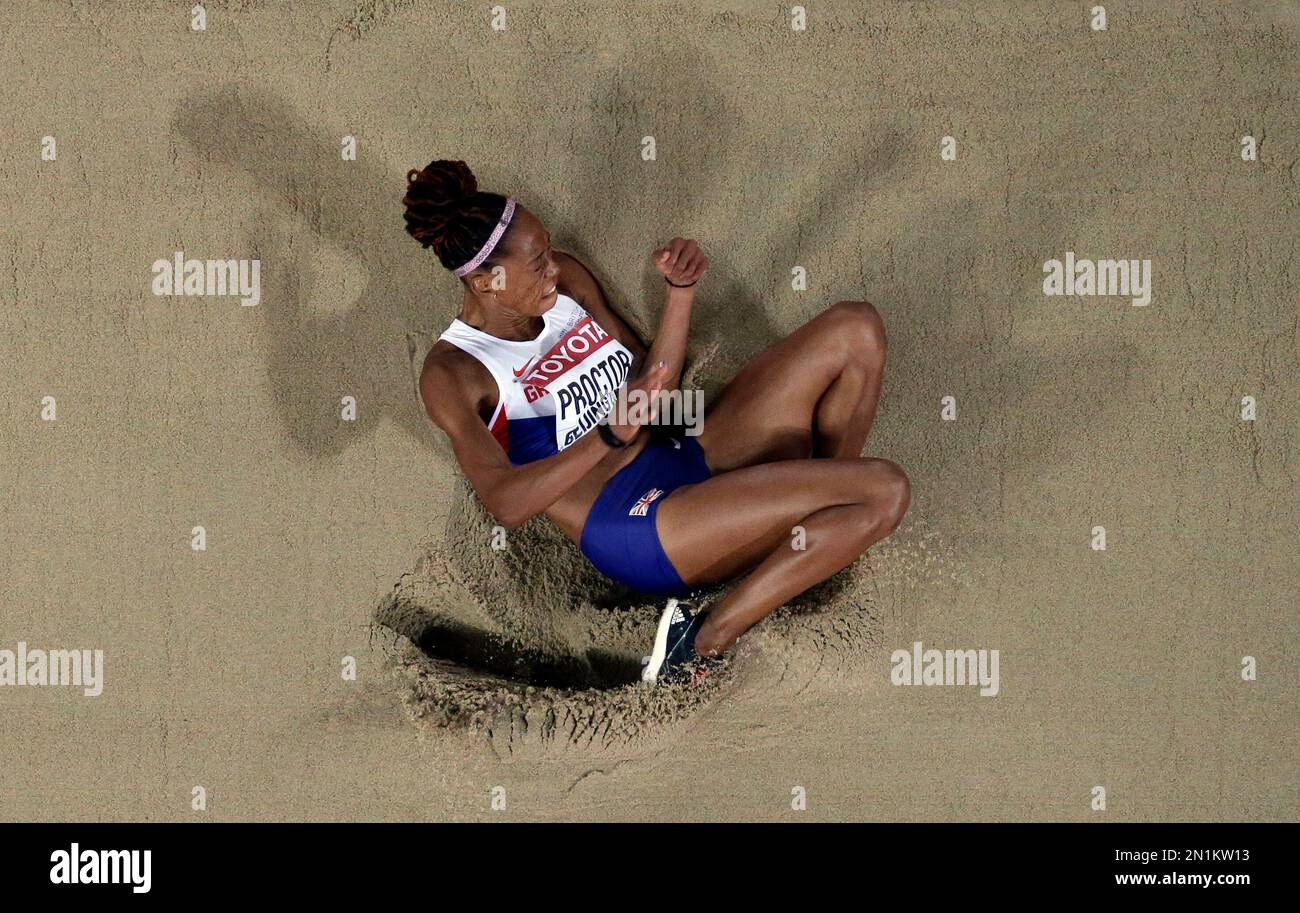 Britain's Shara Proctor lands in the sand as she competes in the women ...