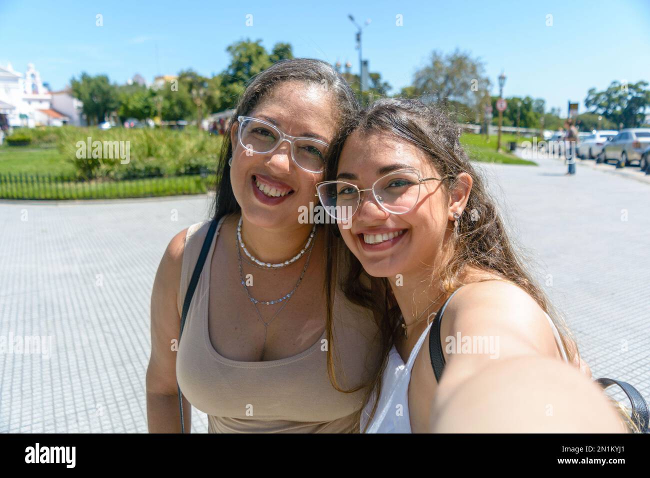 Self-portrait with camera perspective of two young Latina women of ...