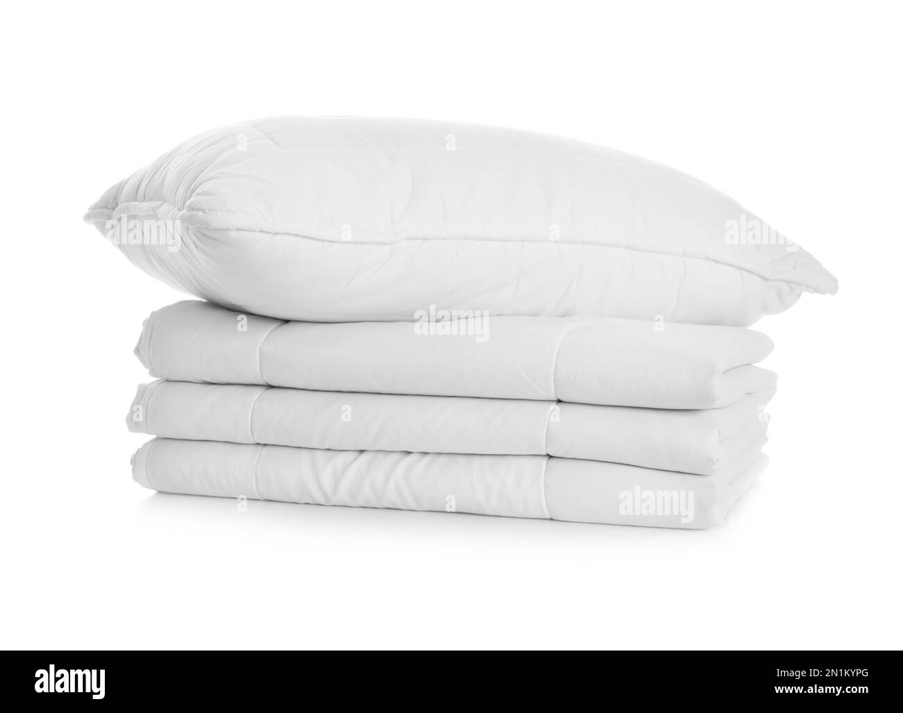Folded clean blanket and pillow isolated on white Stock Photo - Alamy