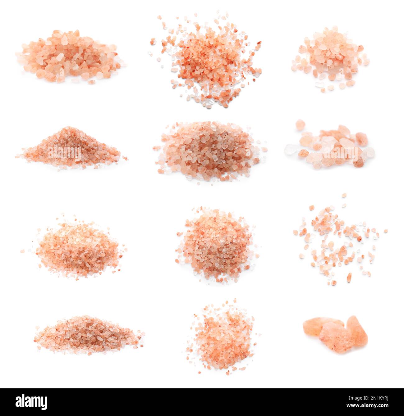 Piles of pink himalayan salt on white background Stock Photo - Alamy