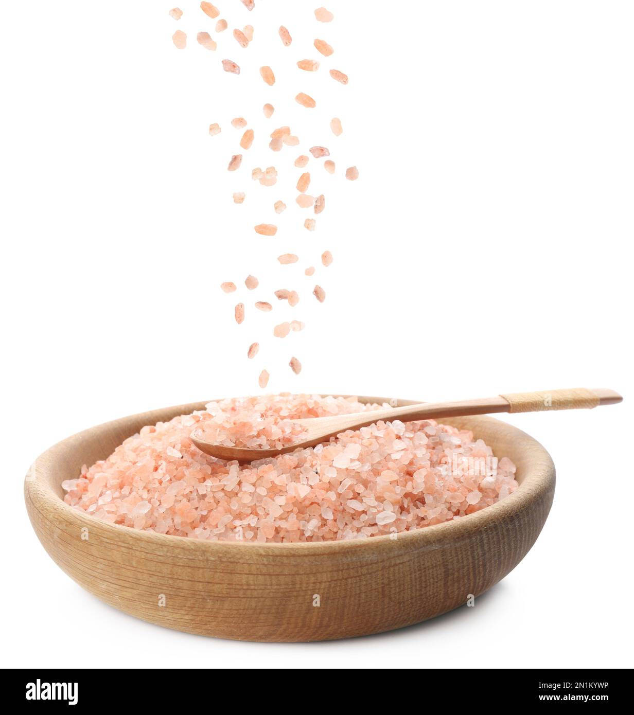 Pink himalayan salt falling into bowl on white background Stock Photo ...