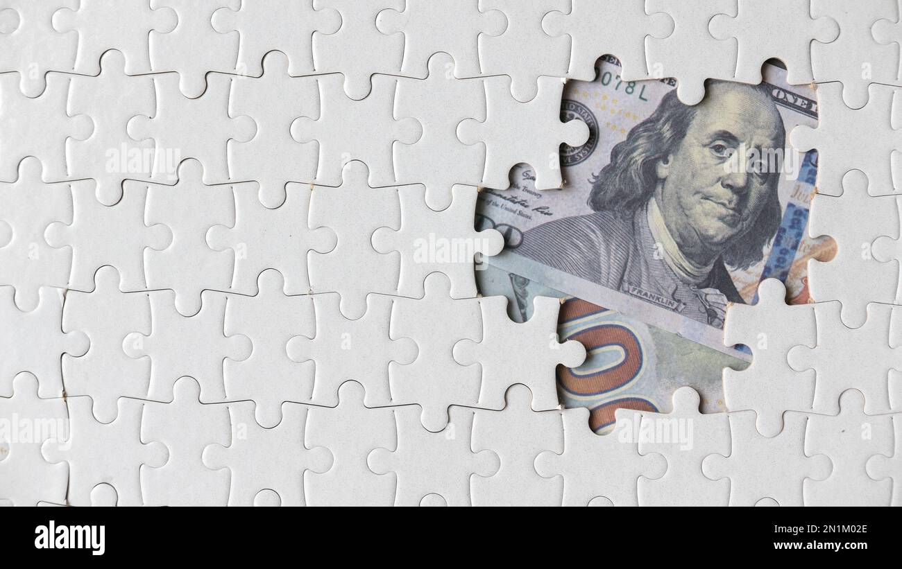 Top view of an empty space of jigsaw puzzle fill with money dollar ...