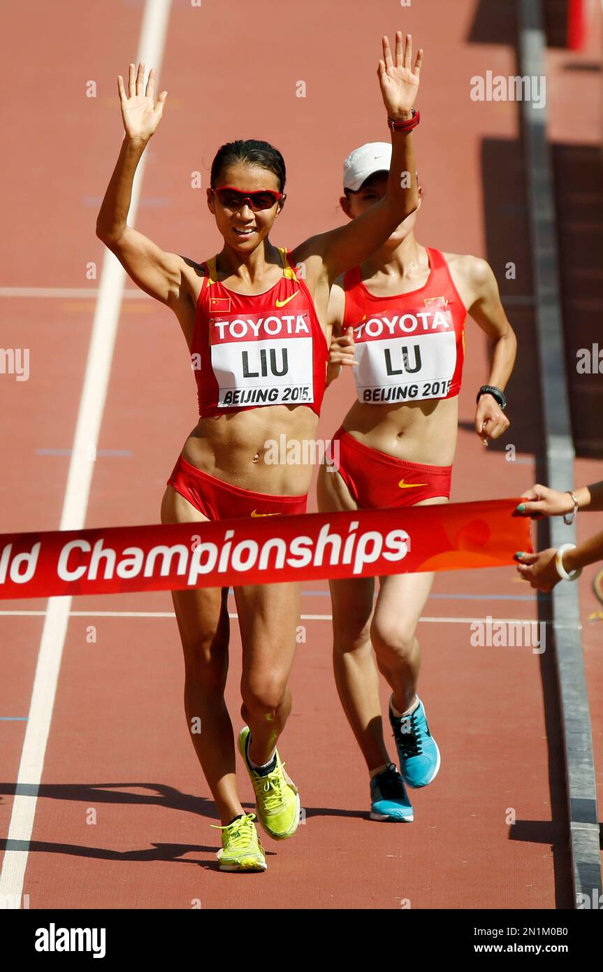 China's Liu Hong celebrates winning the women’s 20k race walk at the ...