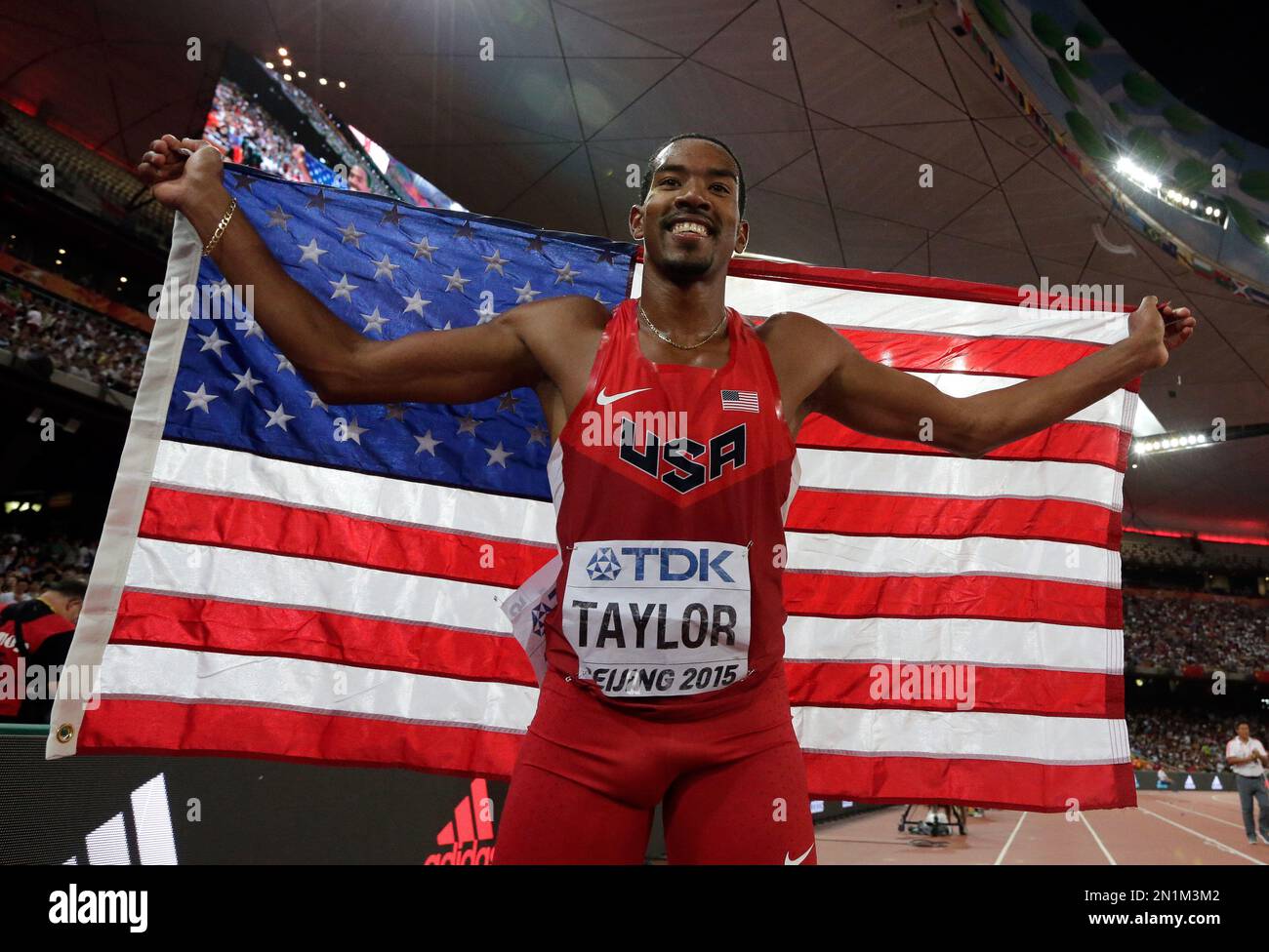 United States' Christian Taylor celebrates after winning the gold medal ...