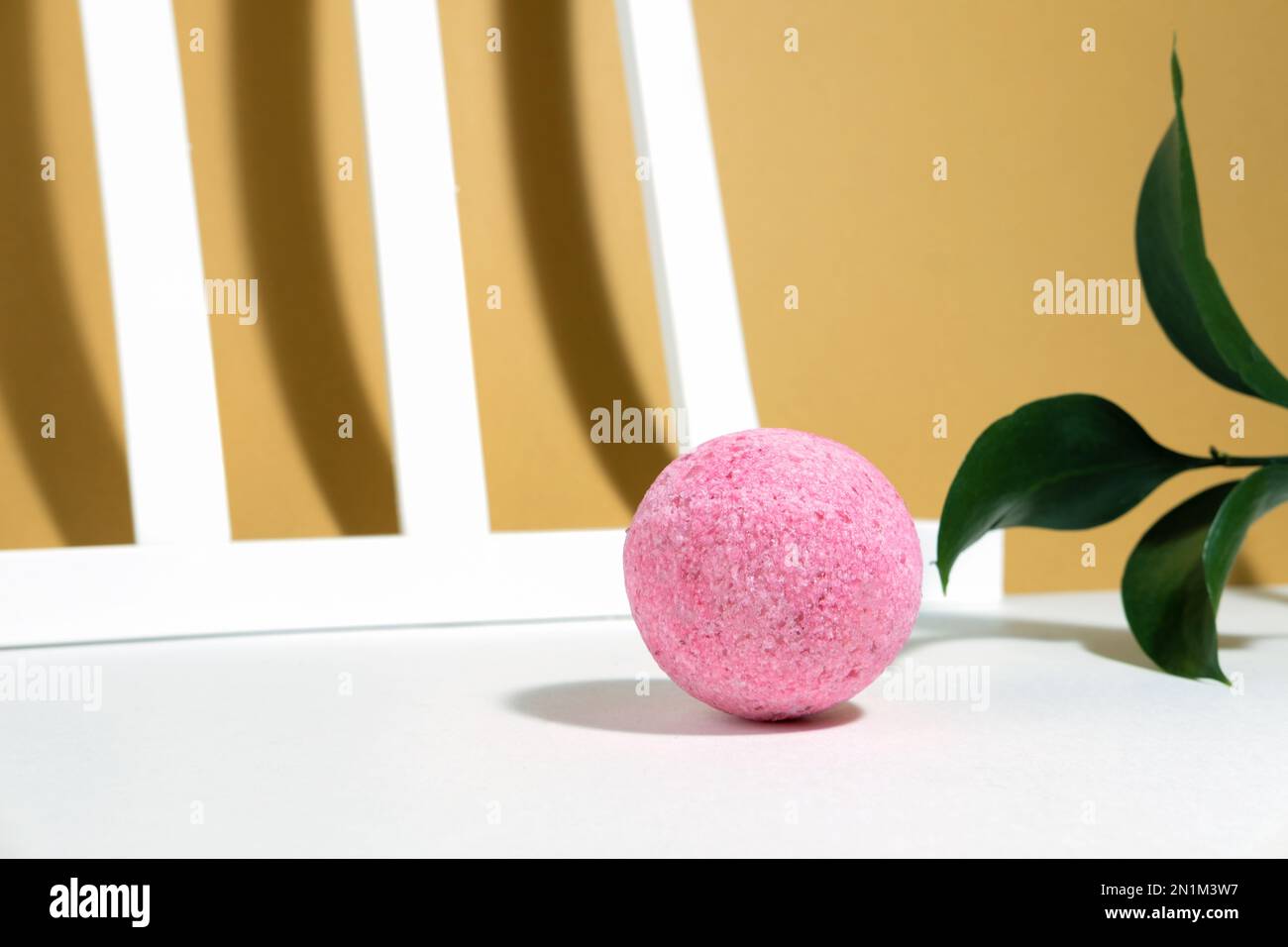 Pink salt bomb on a creative orange beige white background, with ...