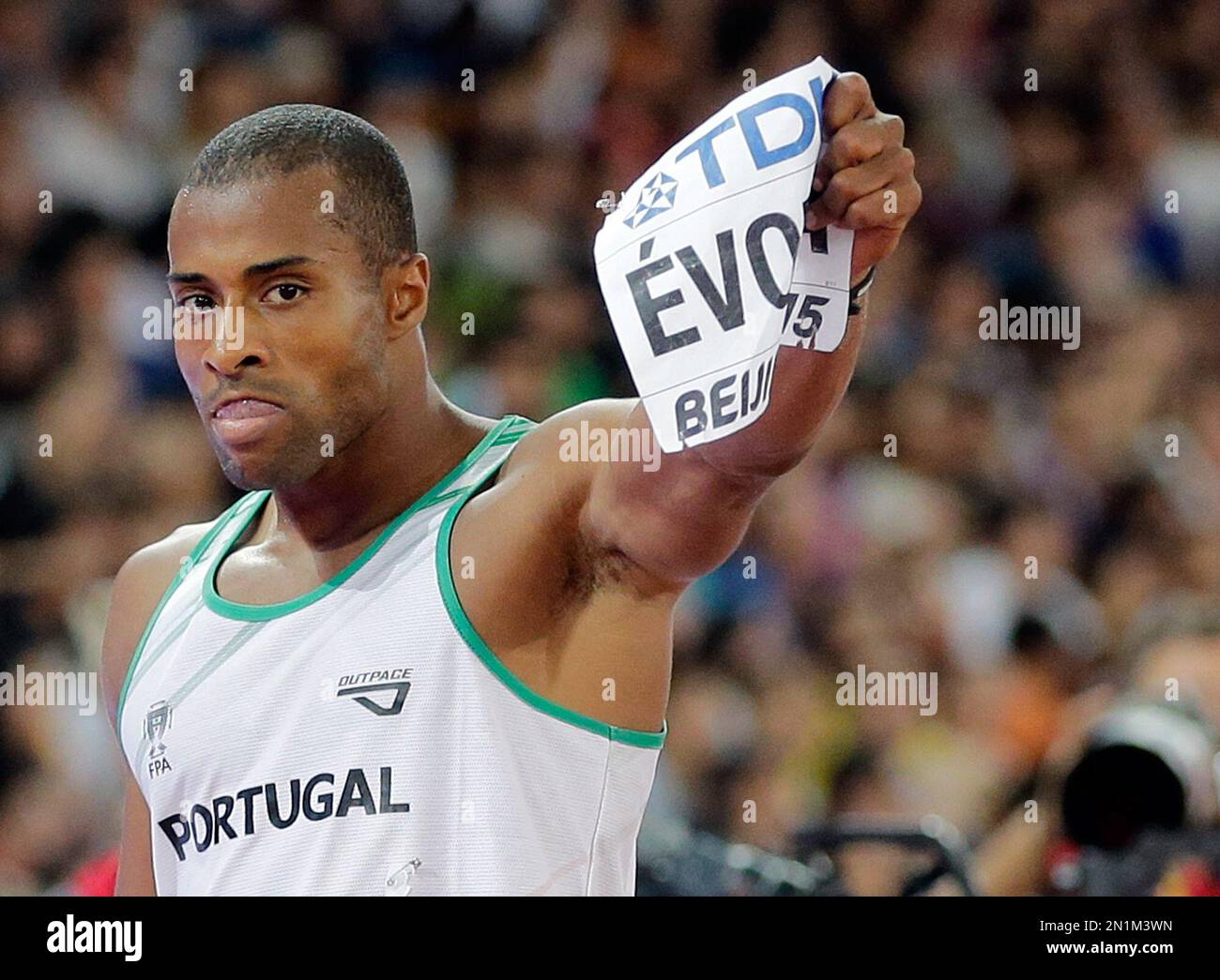 Portugal's Nelson Evora celebrates taking the bronze medal in the men's ...
