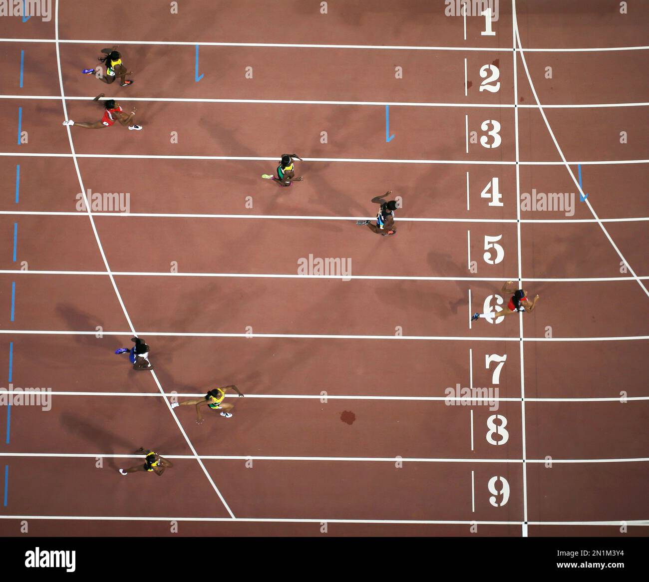 United States' Allyson Felix, lane 6, crosses the finish line to win ...