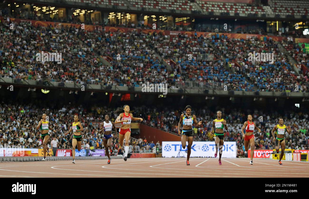 United States' Allyson Felix, middle, crosses the finish line to win ...