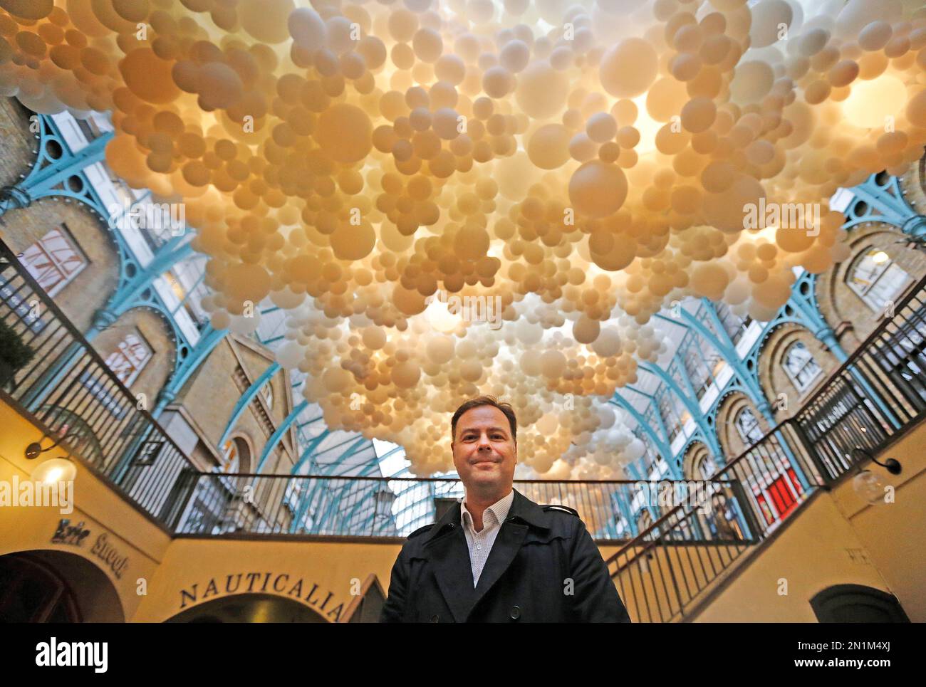 French artist Charles Petillon poses in front of the balloon ...