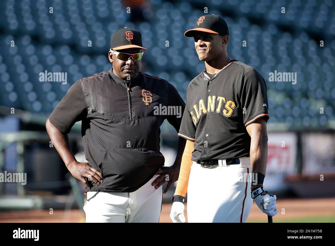 San Francisco Giants batting coach Hensley Meulens, left, and right ...
