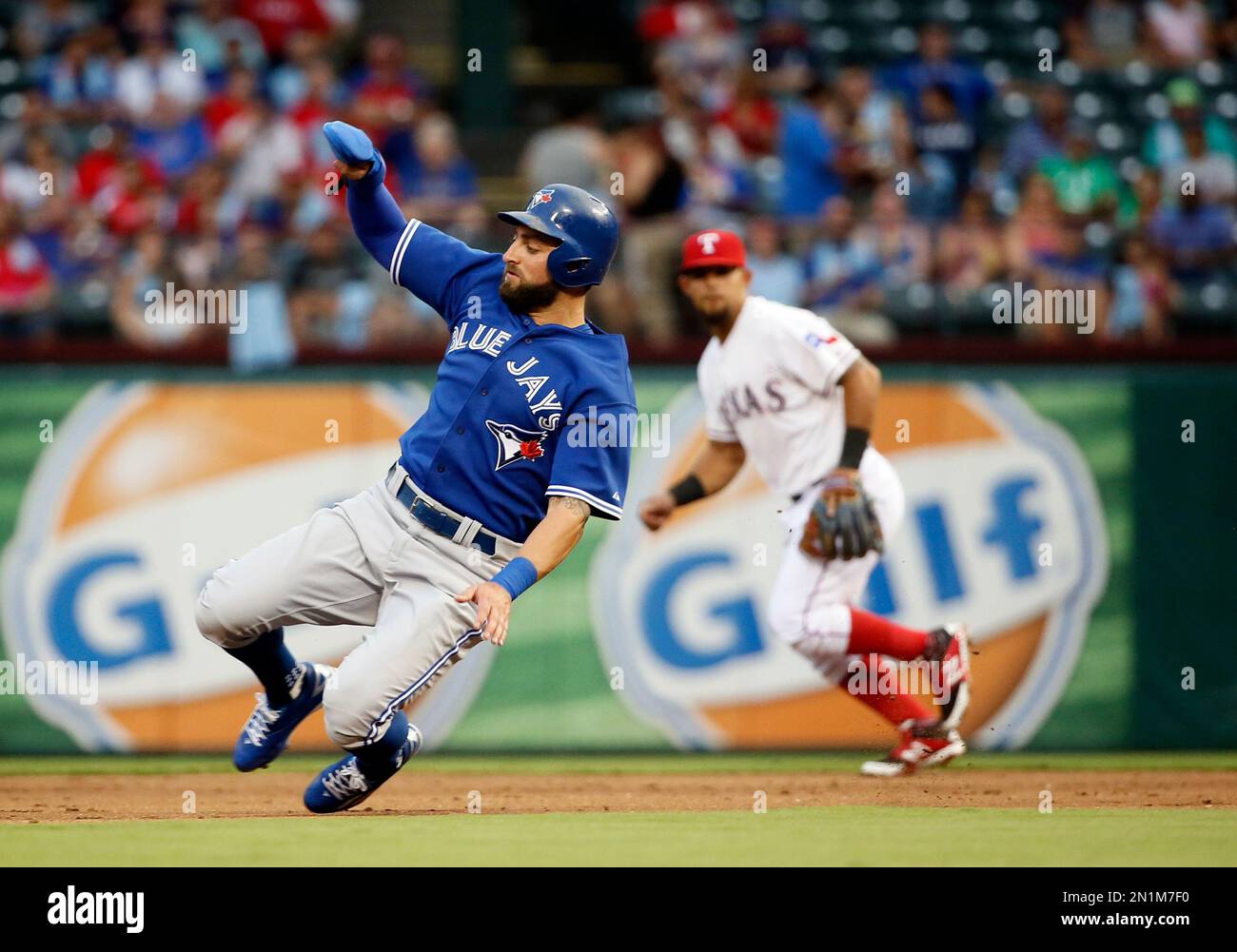 Toronto Blue Jays' Kevin Pillar, left, slides into second on a steal as ...
