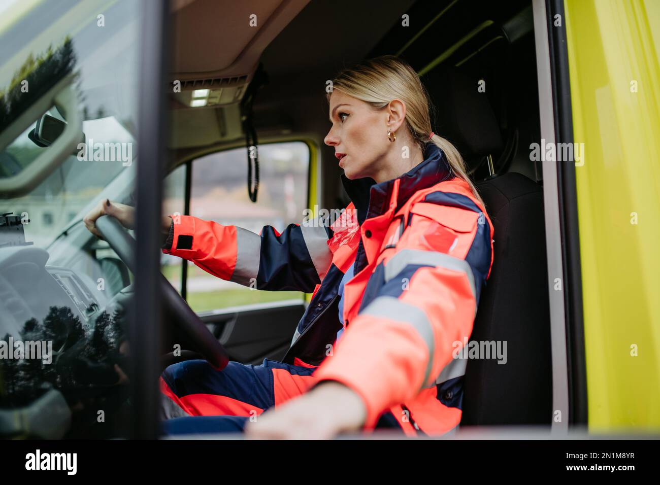 Young woman doctor getting into the ambulance car Stock Photo - Alamy