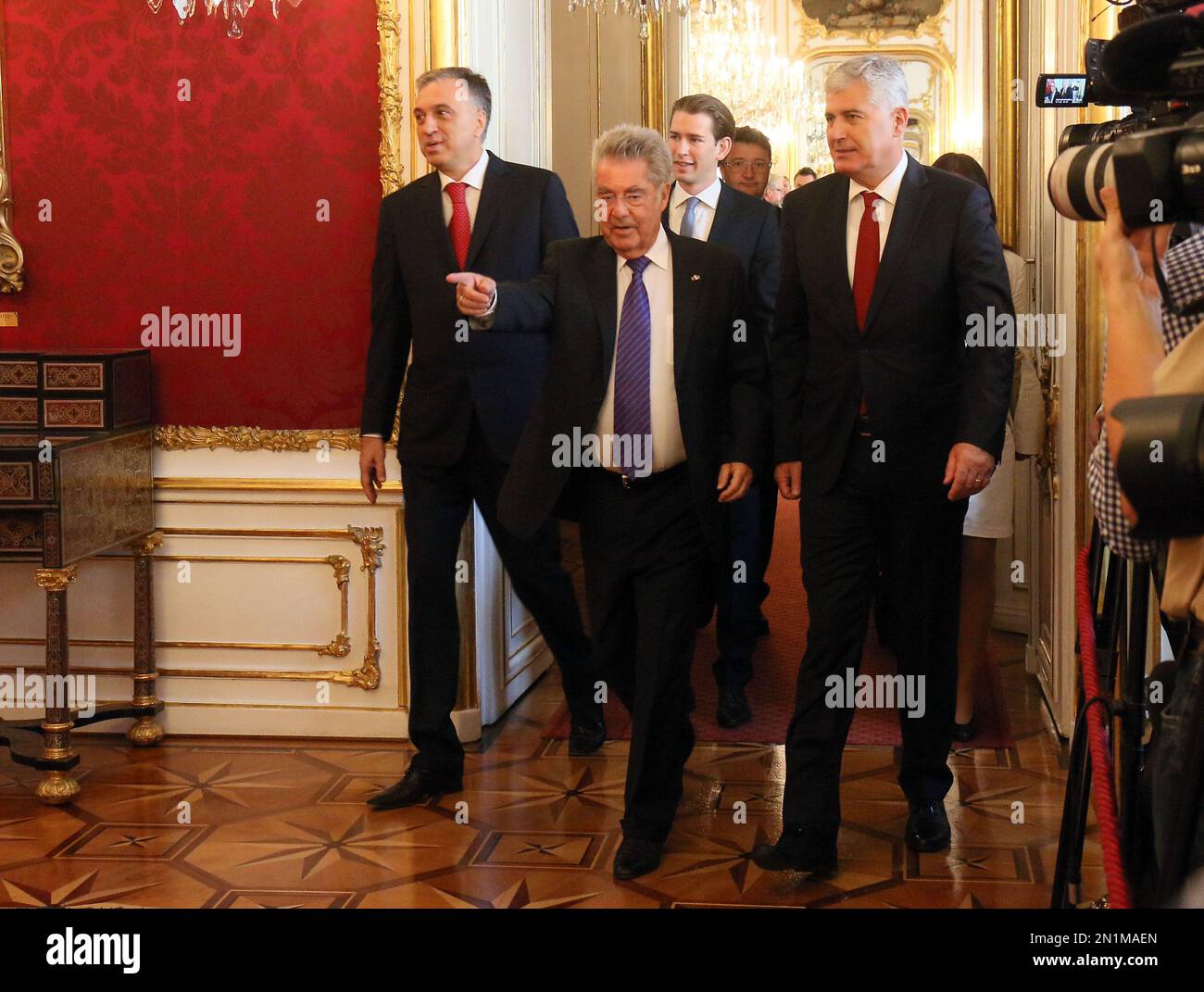 Austrian President Heinz Fischer, center, welcomes the President of ...