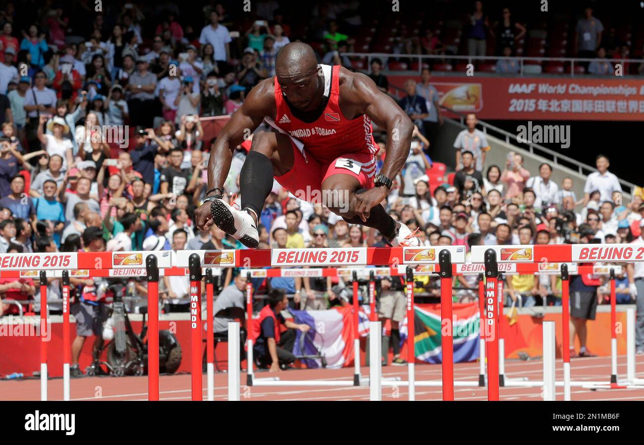 Trinidad and Tobago's Mikel Thomas continues to race after falling in a ...