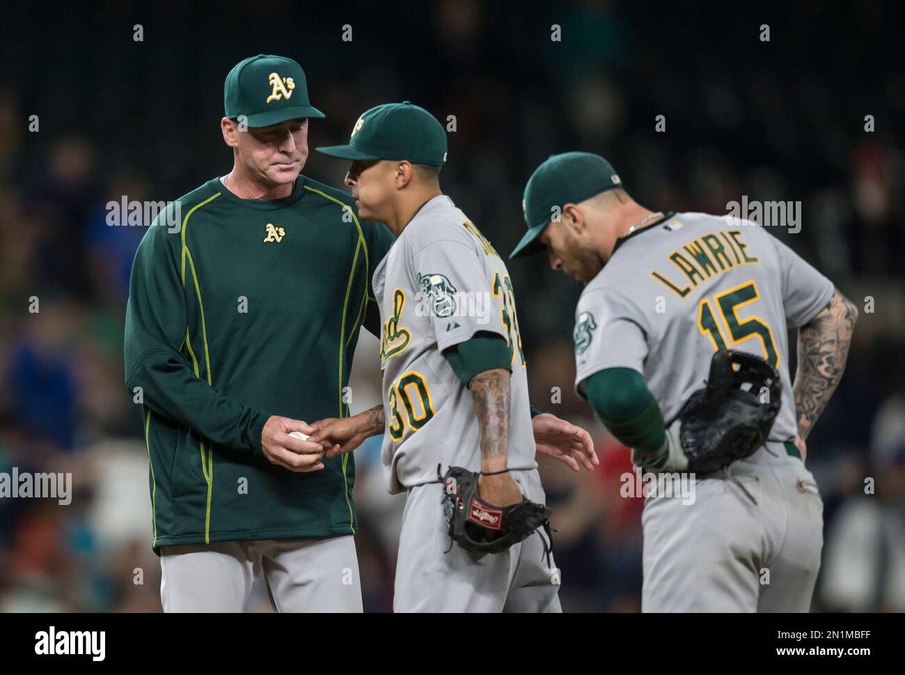 Oakland Athletics manager Bob Melvin, left, pulls starting pitcher ...