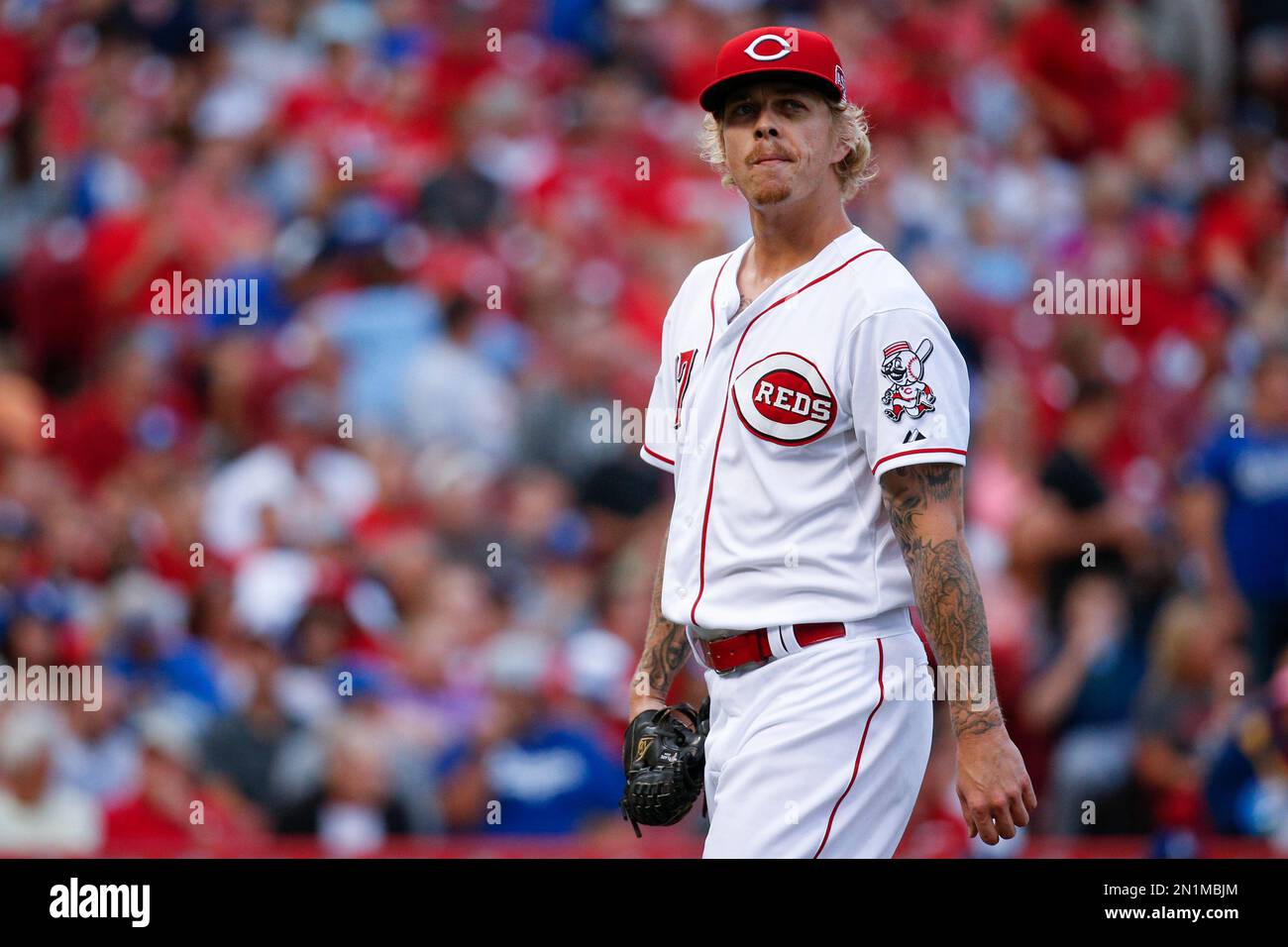 Cincinnati Reds starting pitcher John Lamb walks back to the dugout in ...